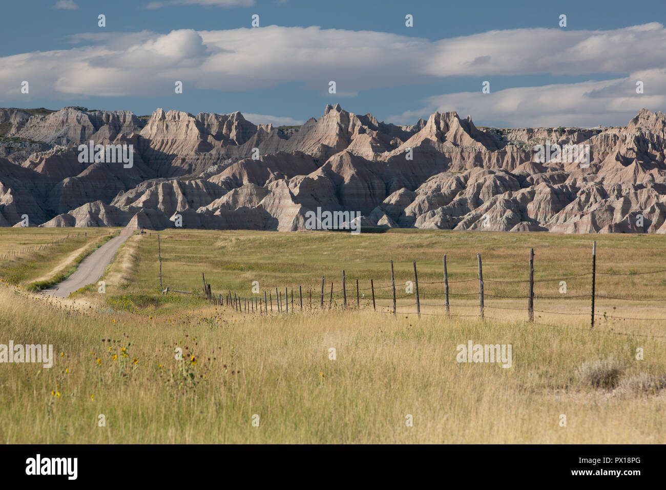 BadLands mountains with beautiful blue sky and clouds Dakota Stock ...