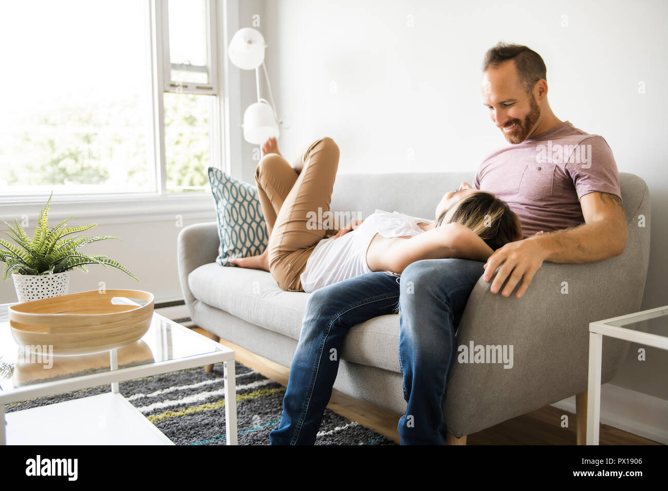 Married couple laying on bed hi-res stock photography and images - Alamy
