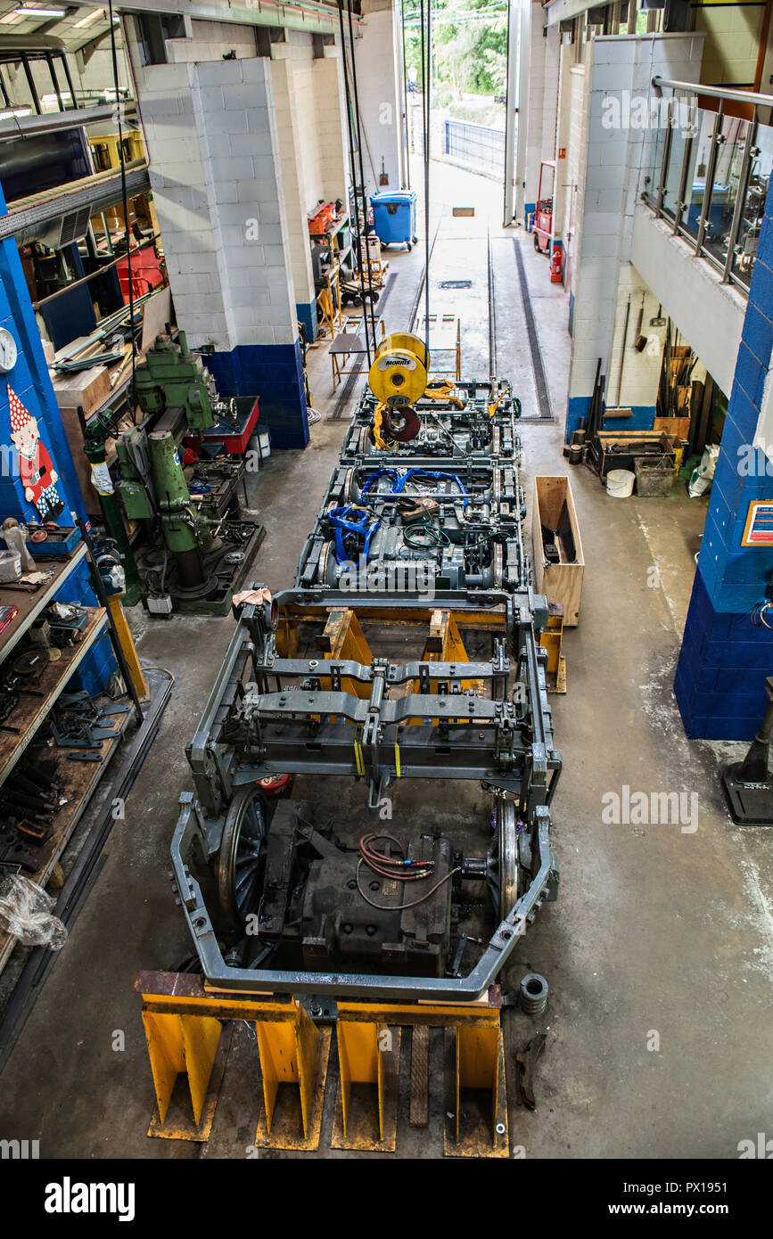 An old british tram is in the workshop being rebuilt at Crich Tramway ...