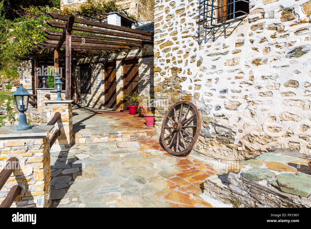 Street and typical greek rural house wall view at Makrinitsa village of ...