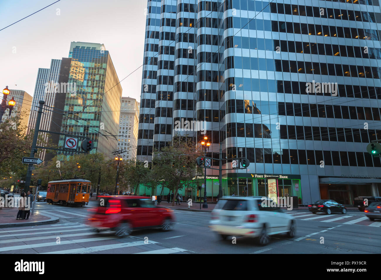Evening traffic at intersection in downtown San Francisco, California ...