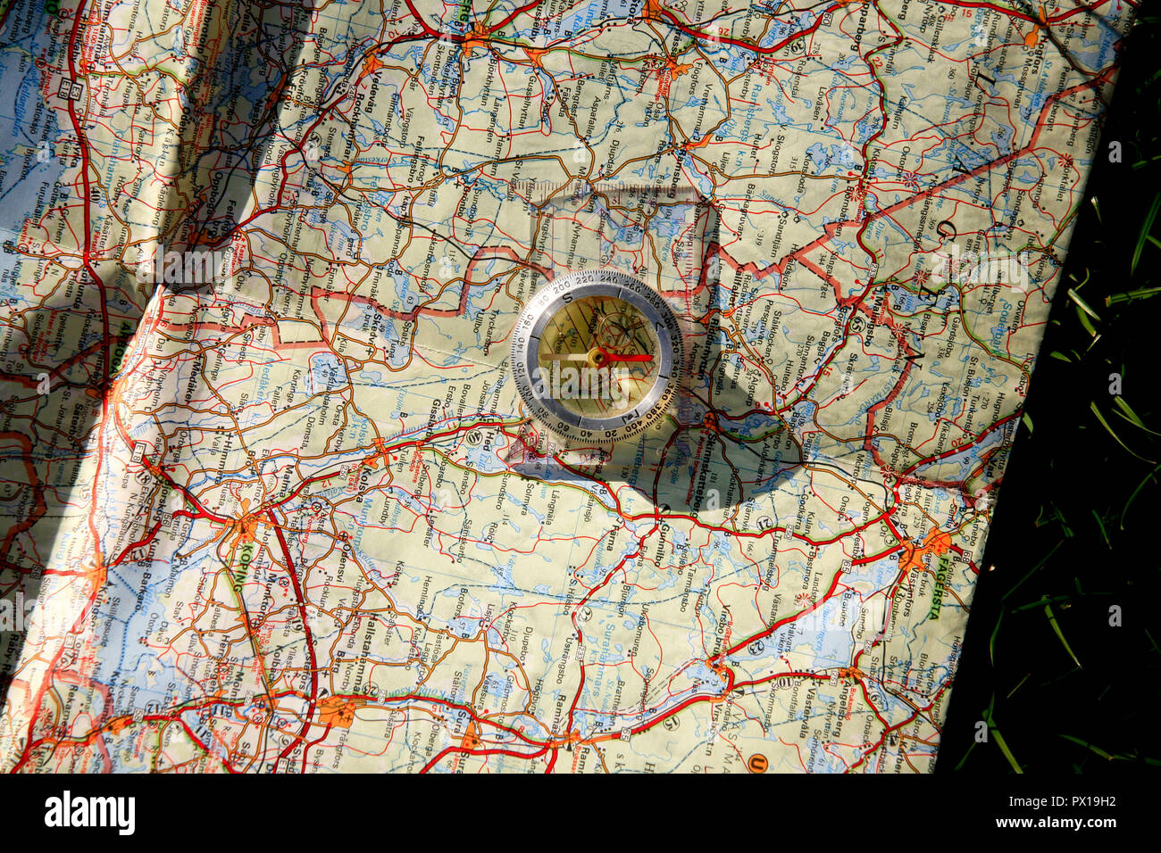 COMPASS AND MAP tourism tools Stock Photo - Alamy