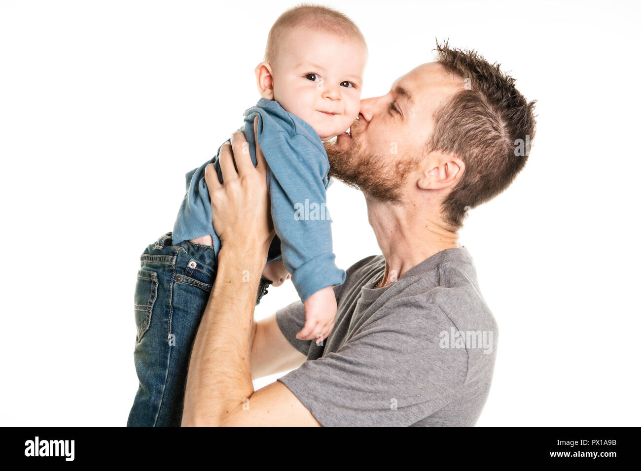 Father with cute baby on studio white background Stock Photo - Alamy