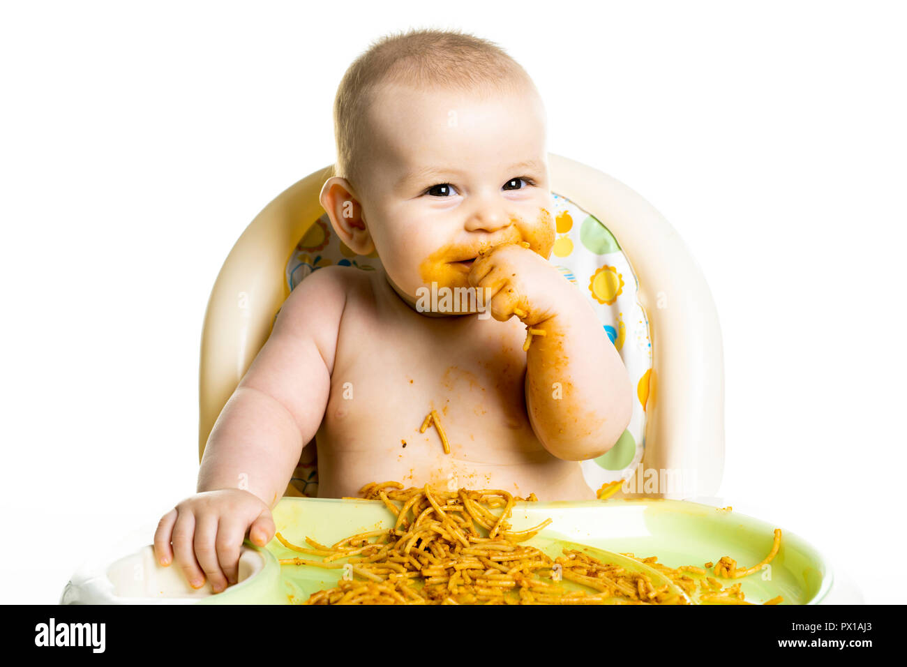 Messy baby boy eating spaghetti hi-res stock photography and images - Alamy