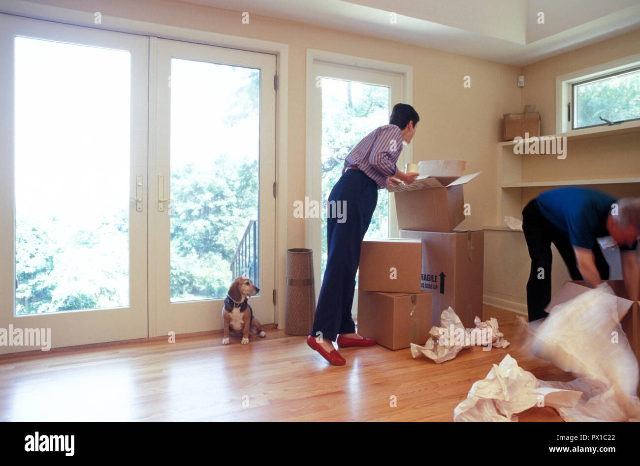Mature couple with moving boxes in home, USA Stock Photo - Alamy