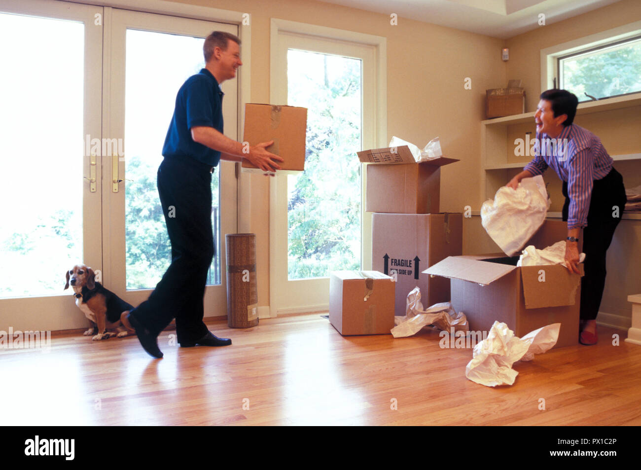 Mature adults moving boxes house hi-res stock photography and images ...