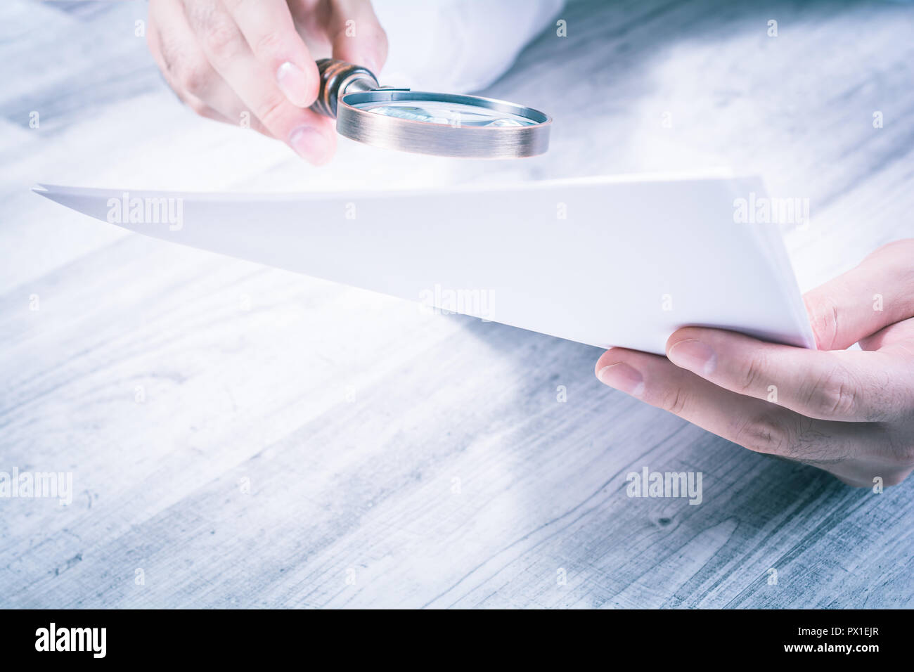 Businessman magnifying glass reading documents hi-res stock photography ...