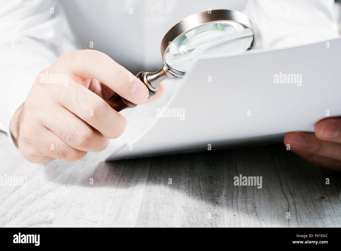 Checking hands with a magnifying glass hi-res stock photography and ...