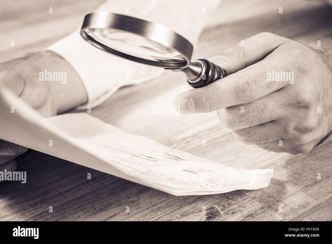 Businessman Checking His Documents With A Magnifying Glass, Monochrome ...
