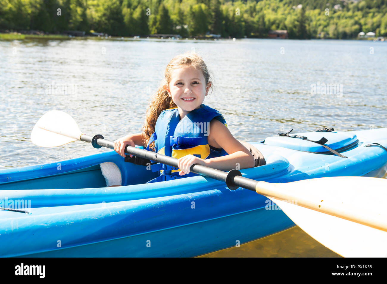 Summer vacation Portrait of happy cute girl kayaking the on river Stock ...