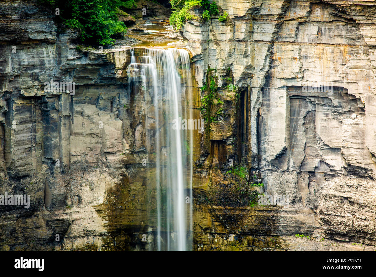 Scenic high mountain waterfall at sunny summer day Stock Photo - Alamy