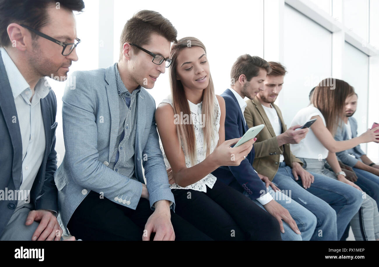 group of young people use their smartphones Stock Photo - Alamy