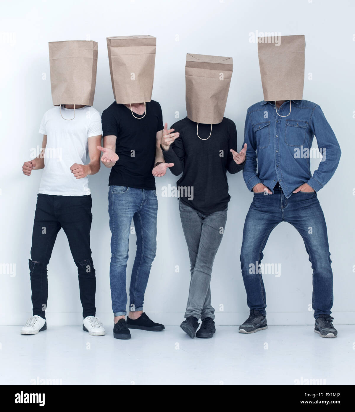group of young people with paper bags on their heads Stock Photo - Alamy