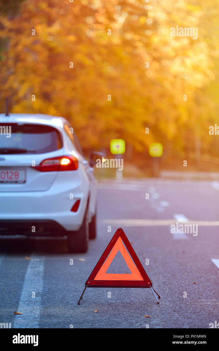 Broken car concept, breakdown triangle on road Stock Photo - Alamy
