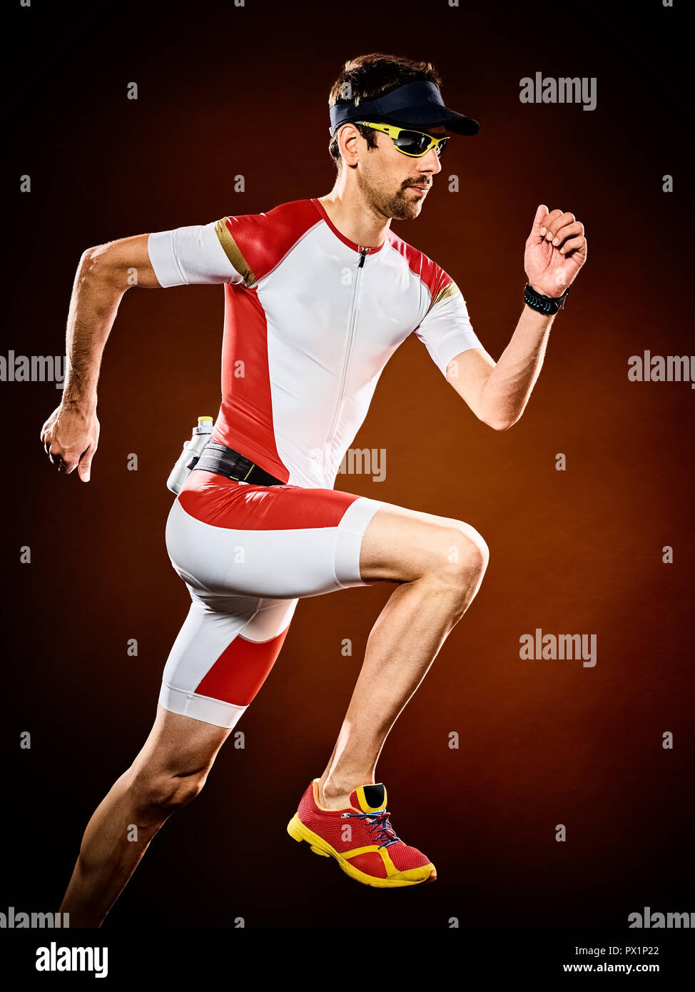 one caucasian man runner running triathlon ironman isolated Stock Photo ...