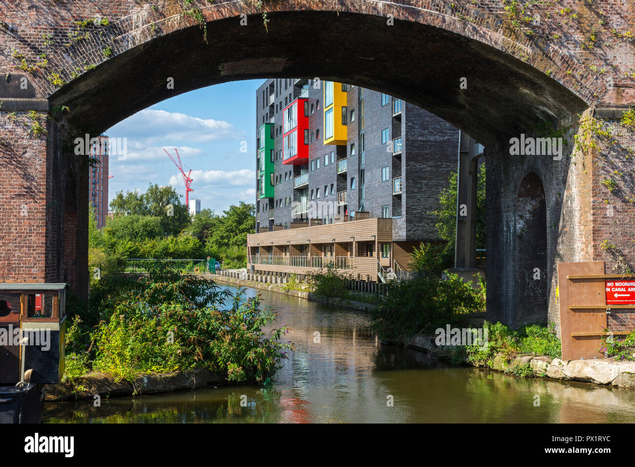 The Potato Wharf apartments seen through a Victorian railway bridge ...