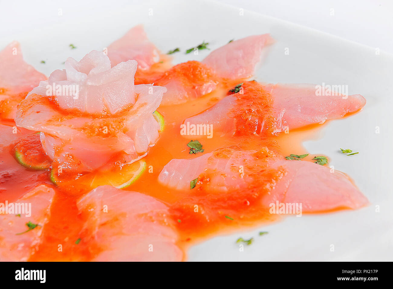Tiradito.Typical Peruvian dish. On a white background Stock Photo - Alamy