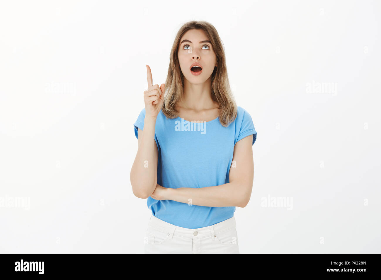 Look, so interesting and amusing. Portrait of intrigued attractive ...