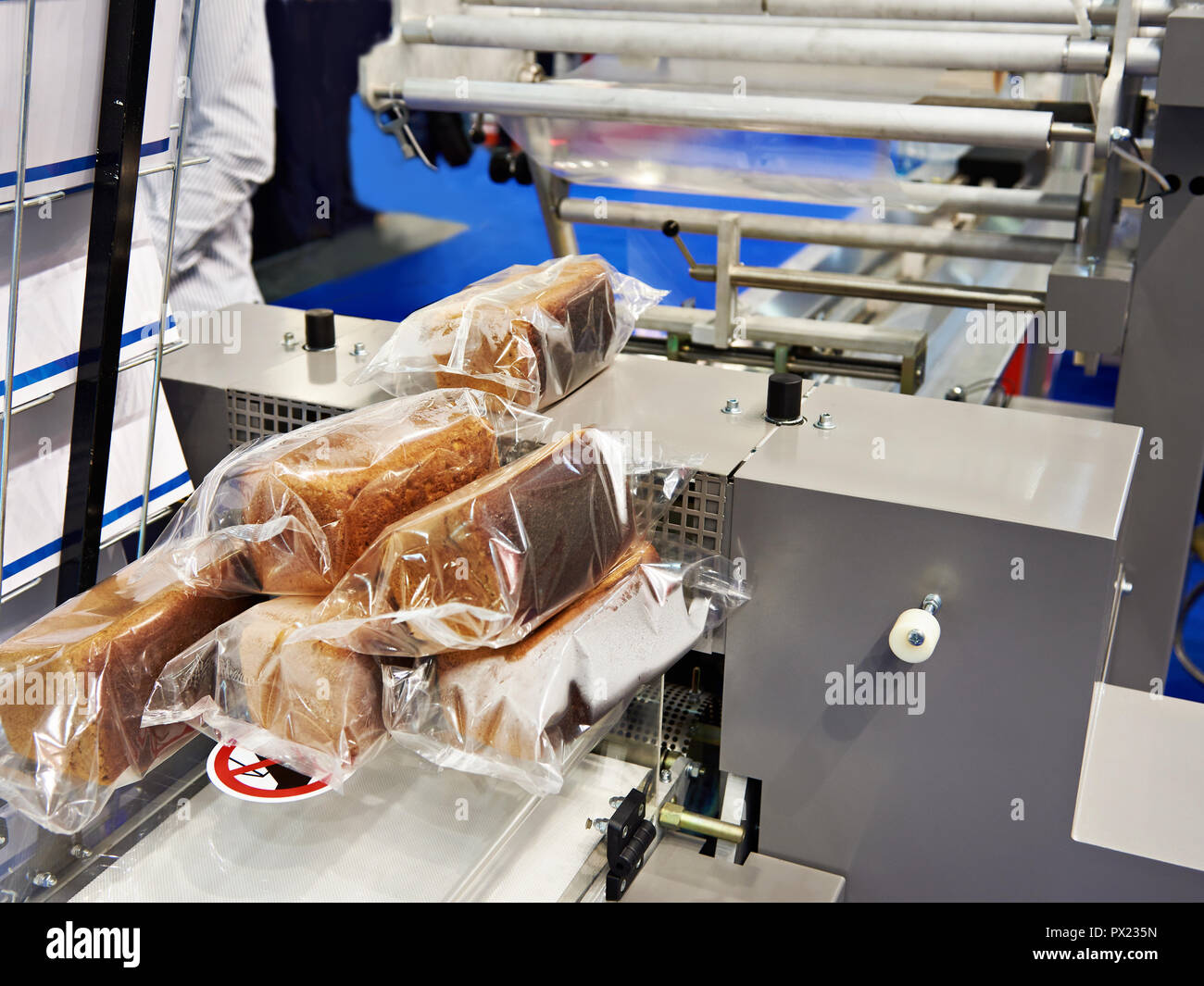 Packing of bread at the factory Stock Photo - Alamy