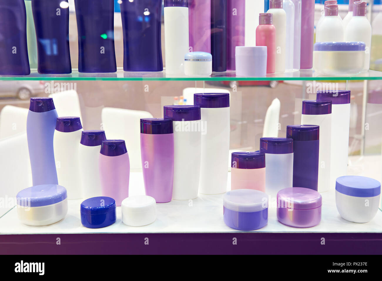 Shop window with plastic cosmetic bottles and shampoo Stock Photo - Alamy