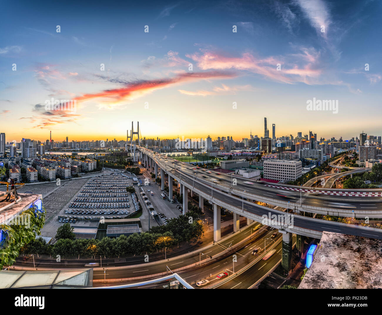Aerial view of the traffic light trail and the city skyline Stock Photo ...