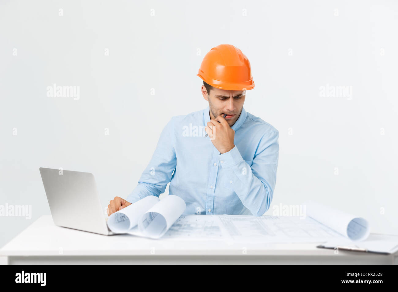 Portrait of confused male designer or architect, feels stressed, being ...