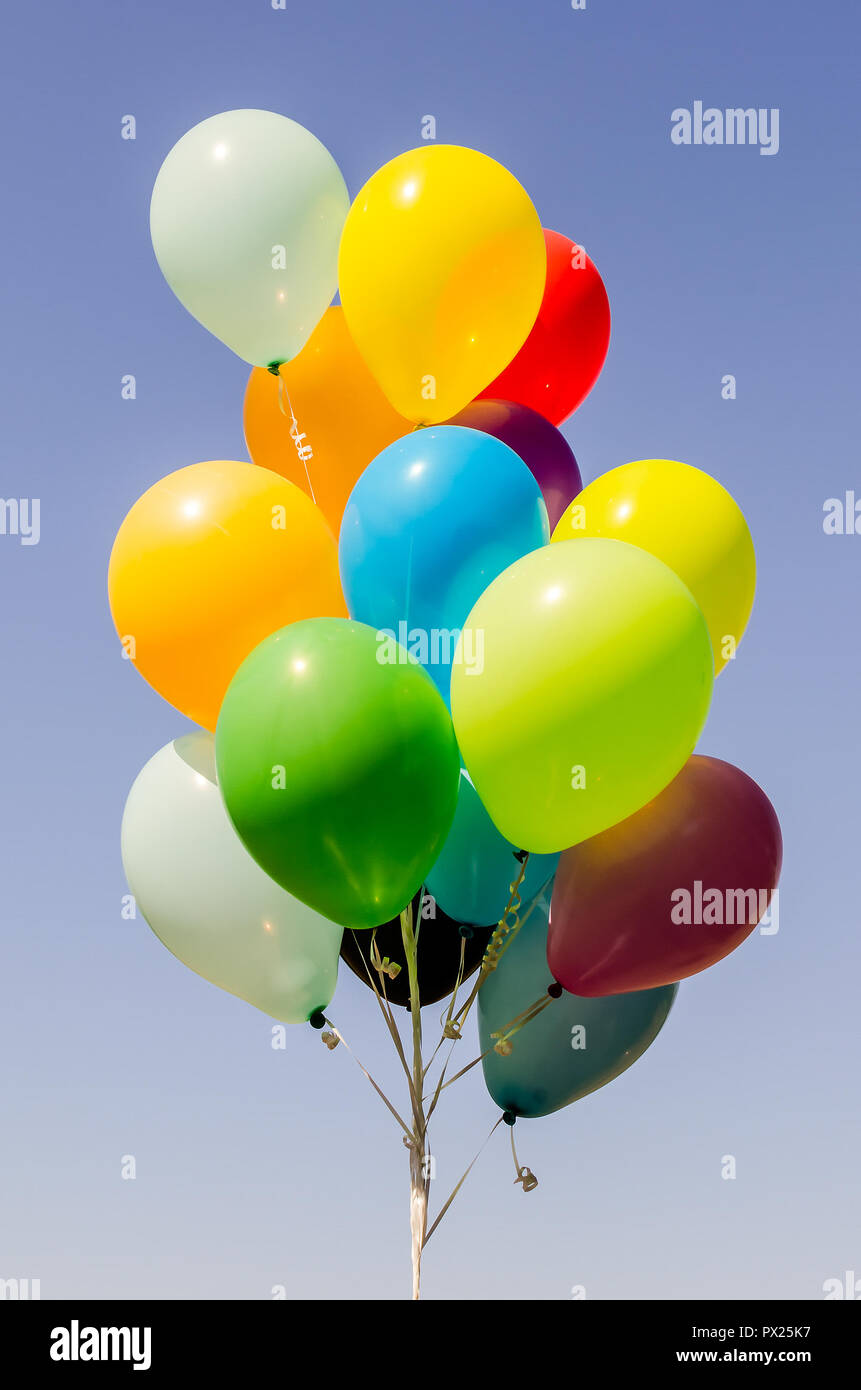 Bunch of helium balloons hi-res stock photography and images - Alamy