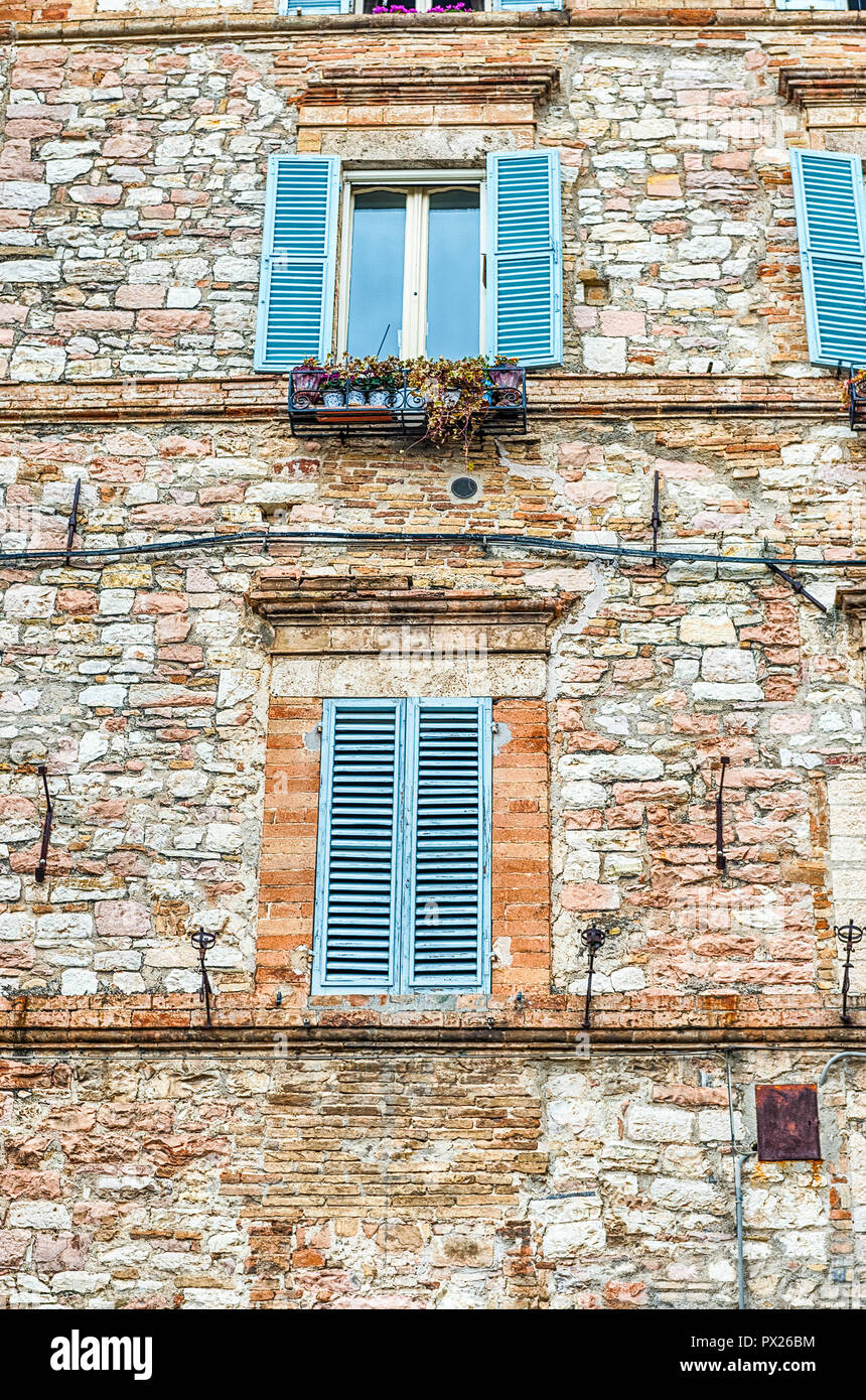 Historical buildings in the old city center of Assisi, one of the most ...