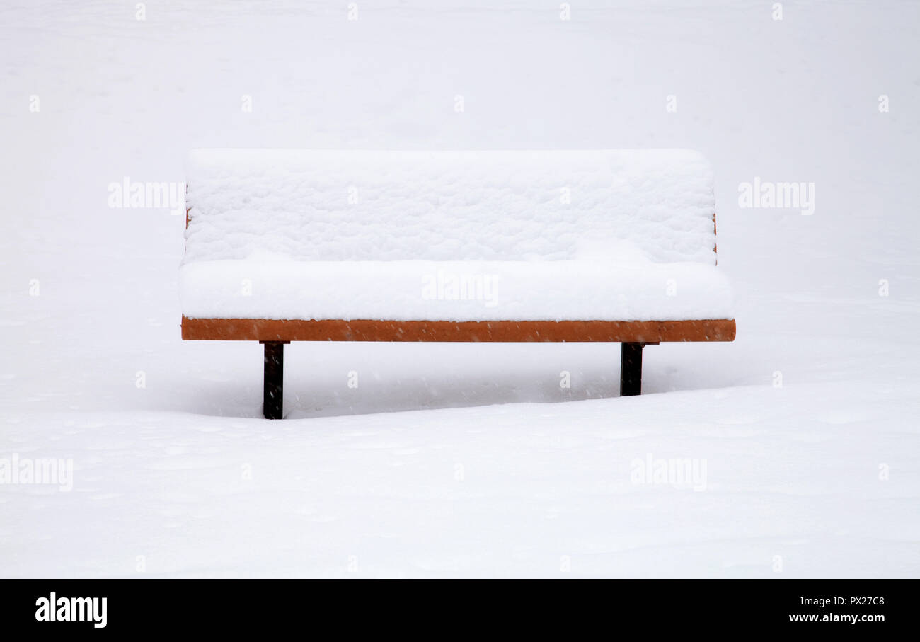 Snow covered bench during spring snow storm in Boulder, Colorado, USA ...