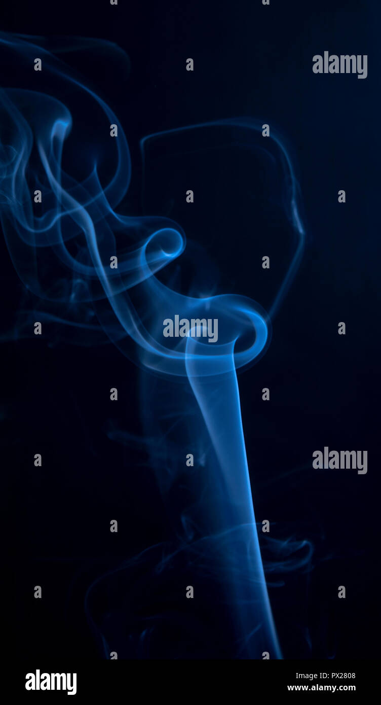 Abstract blue smoke swirls on dark background Stock Photo - Alamy