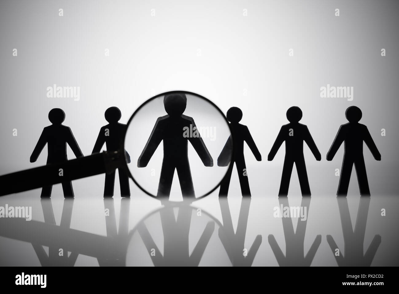 Silhouette Of A Human Figure Seen Through Magnifying Glass On ...