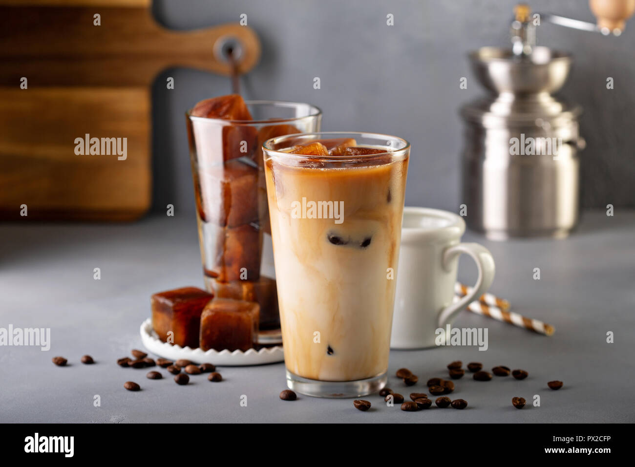 Iced coffee in tall glasses made with coffe ice cubes Stock Photo - Alamy