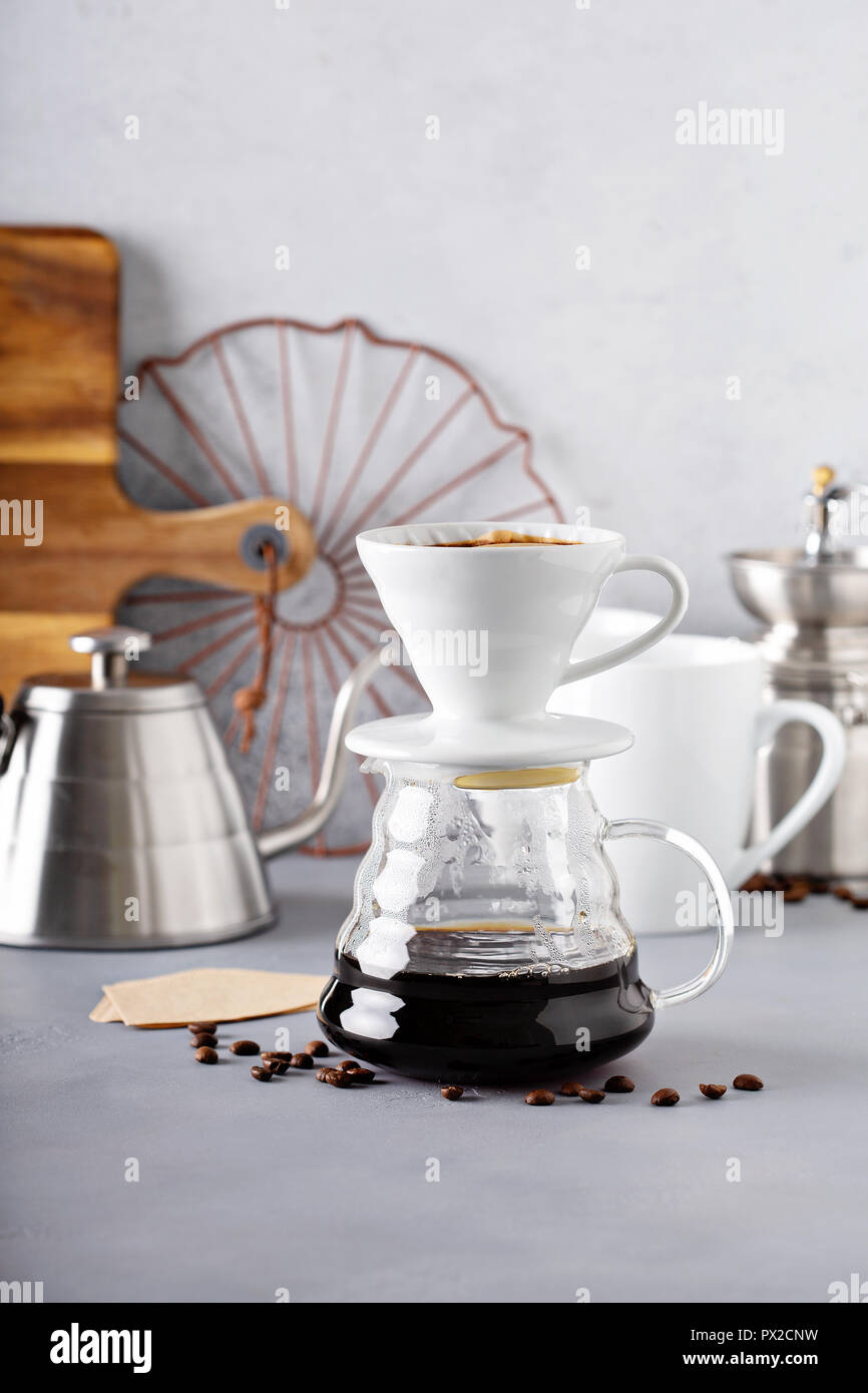 Pour over coffee being made with a kettle and glass carafe Stock Photo ...