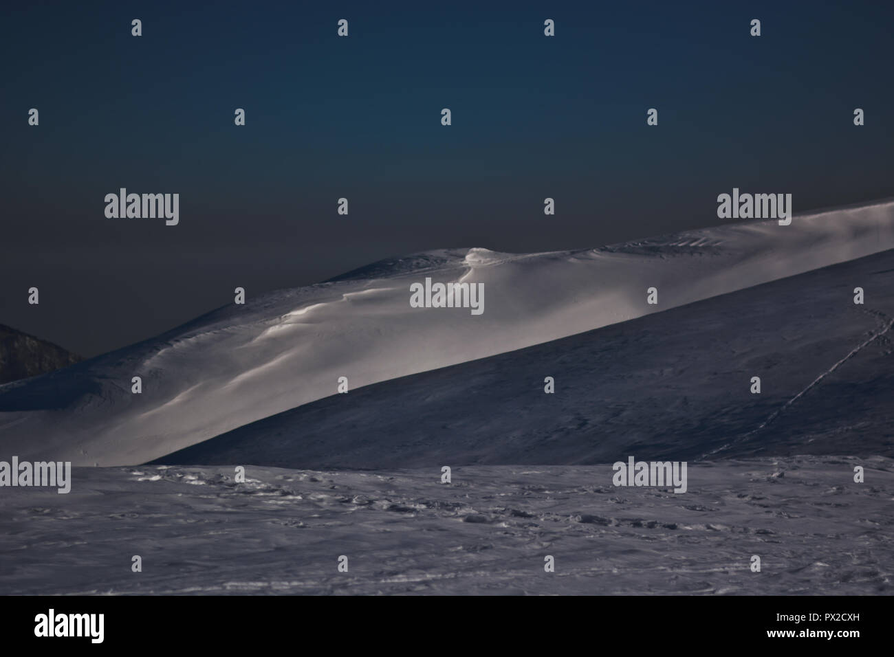 the sun sets at over 4000 meters of height Stock Photo - Alamy