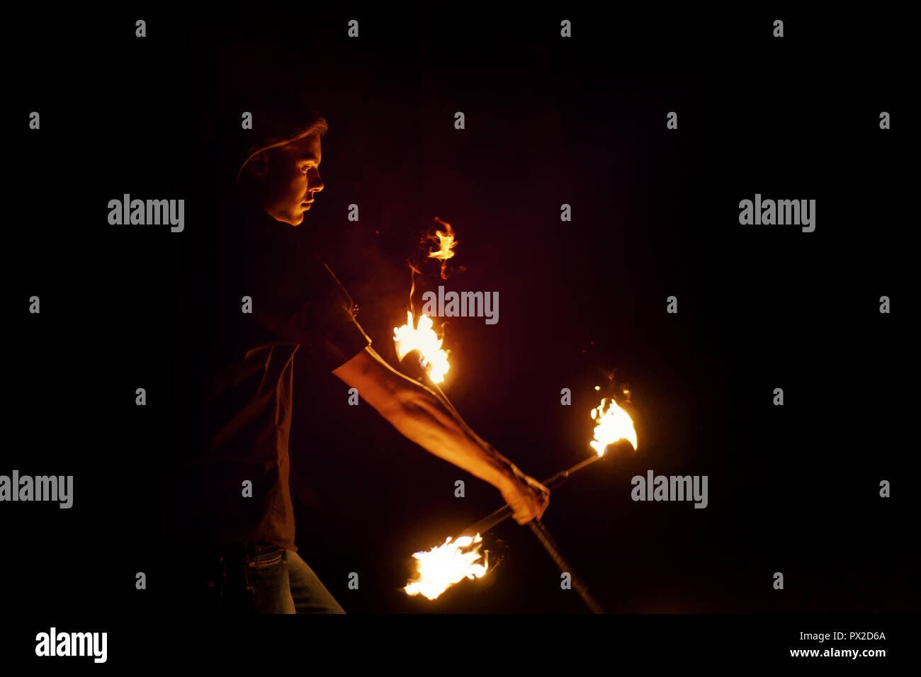Fire show. Fakir dances with two Staff. Night performance. Fire and ...