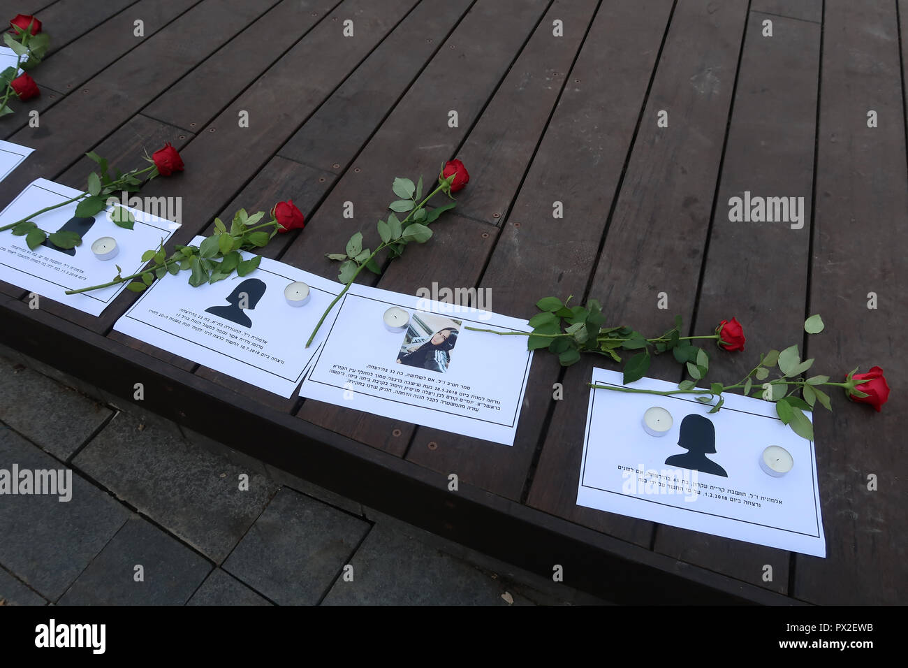 Papers with photographs and names of female homicide victims lay in ...