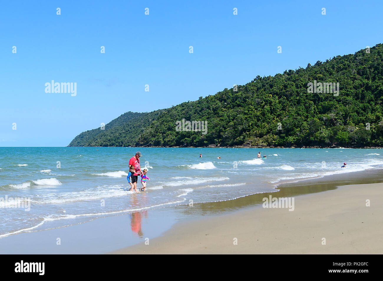 Family on the beach at Etty Bay on the Cassowary Coast, Far North ...