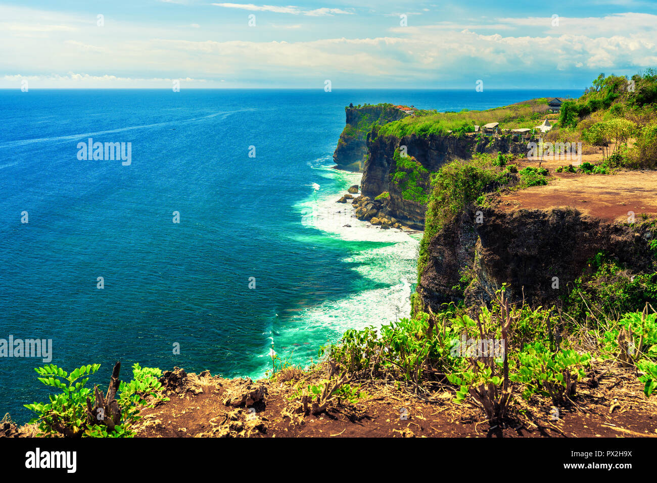 Azure beach with rocky mountains and clear water of Indian ocean at ...