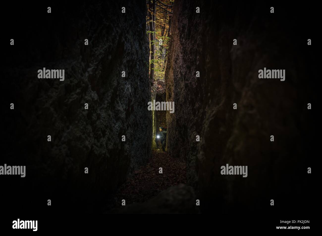 The Ultimate Cave Explorer. Caucasian Men in His 30s in the Narrow ...