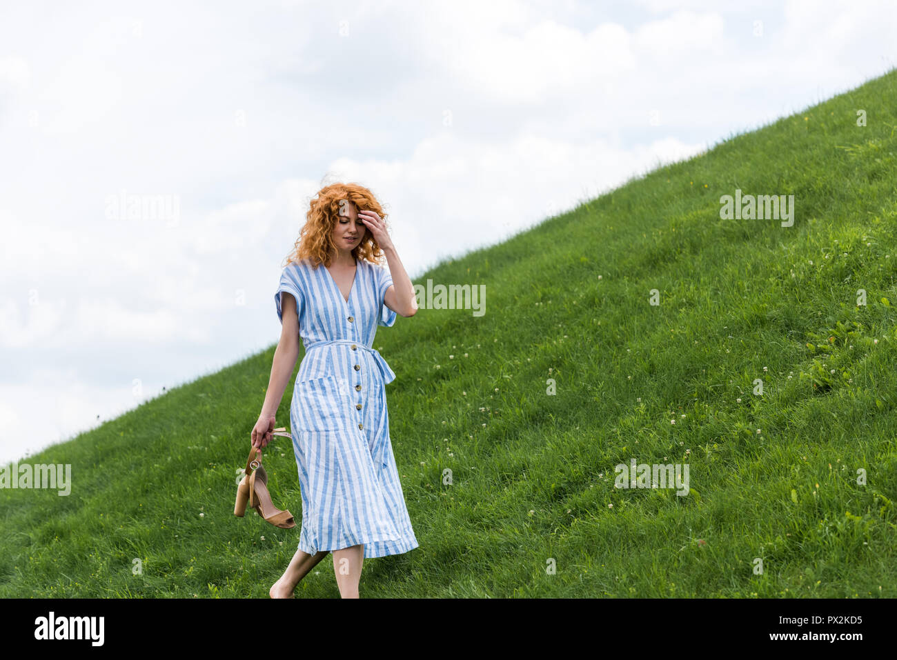 Woman carrying shoes hi-res stock photography and images - Alamy