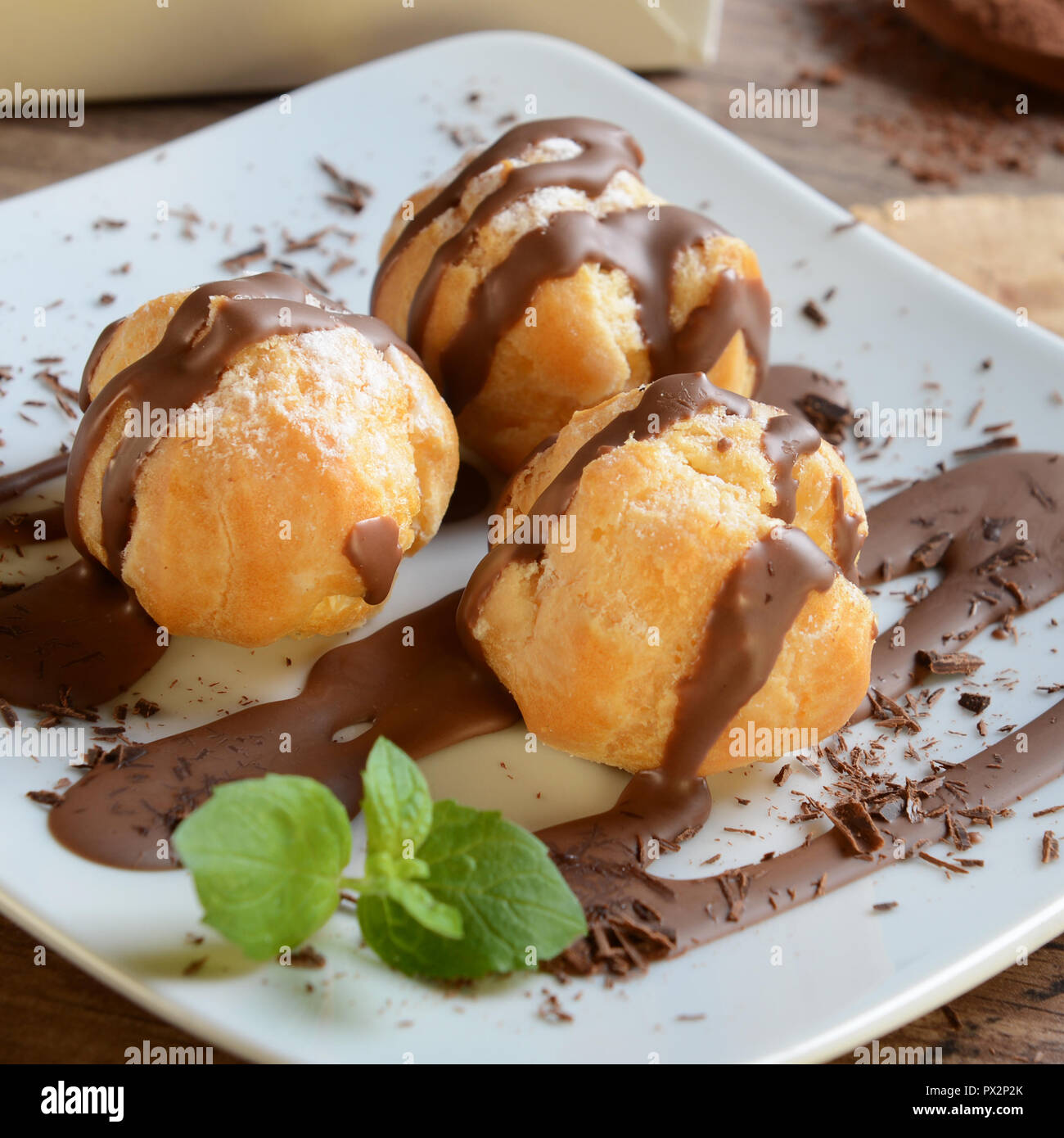 Profiteroles - italian dessert witch chocolate sauce Stock Photo - Alamy