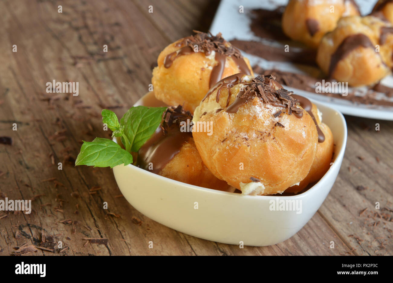 Profiteroles - italian dessert witch chocolate sauce Stock Photo - Alamy