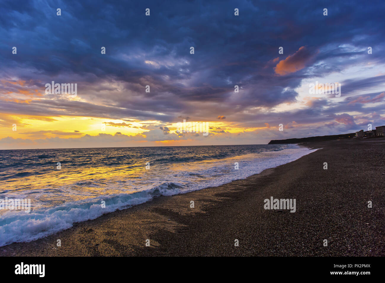 sunset on beach Stock Photo - Alamy