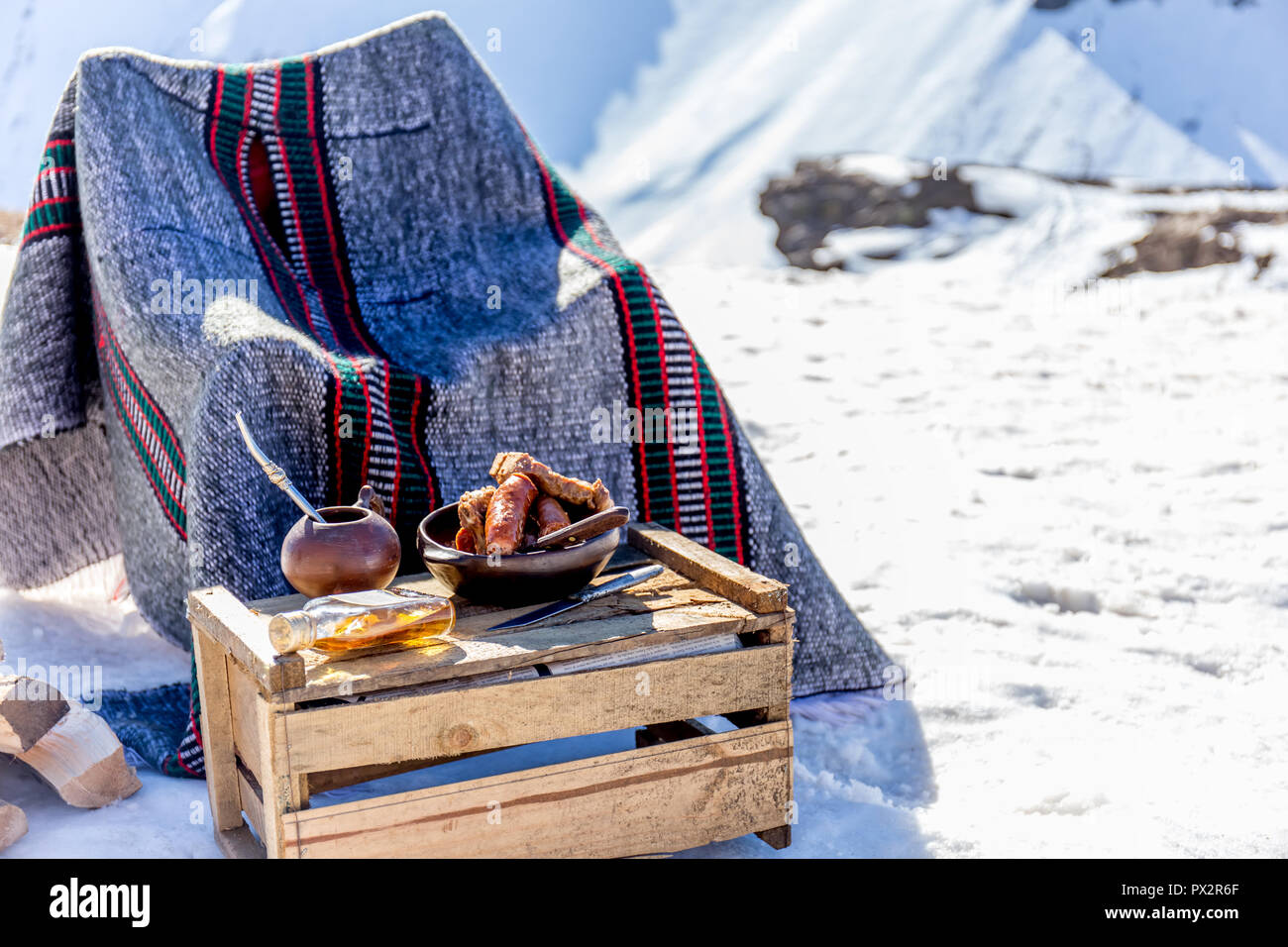 Winter picnic in chilean argentine snow mountaines Andes with hot meat ...