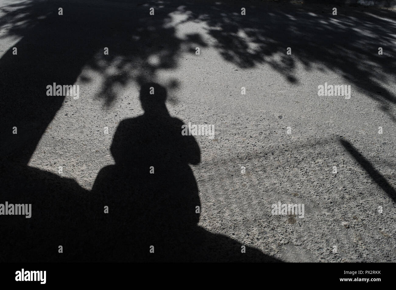 the shadow of a man holding a camera, self-portrait of a tourist ...