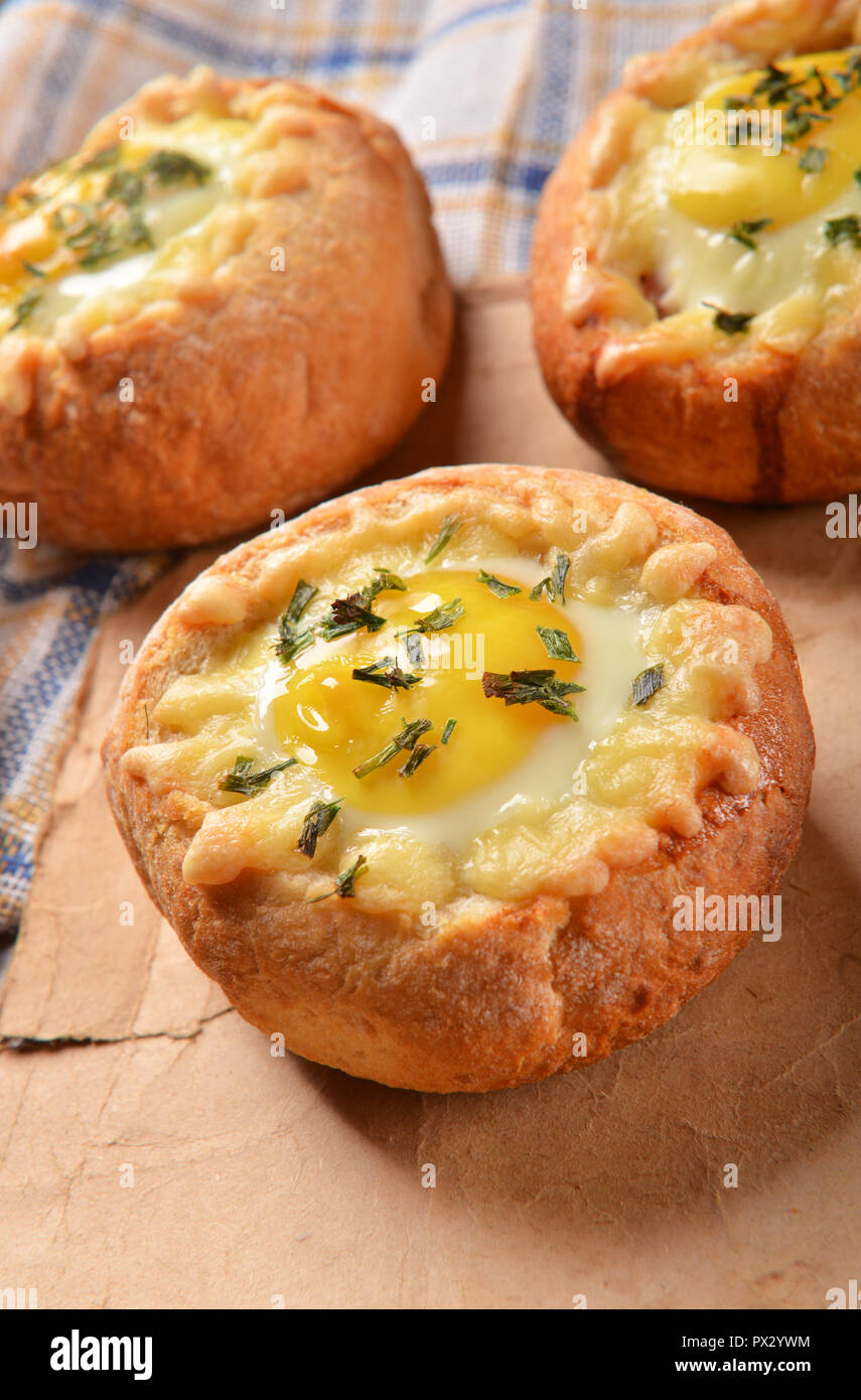 Roasted buns stuffed with eggs and bacon Stock Photo - Alamy