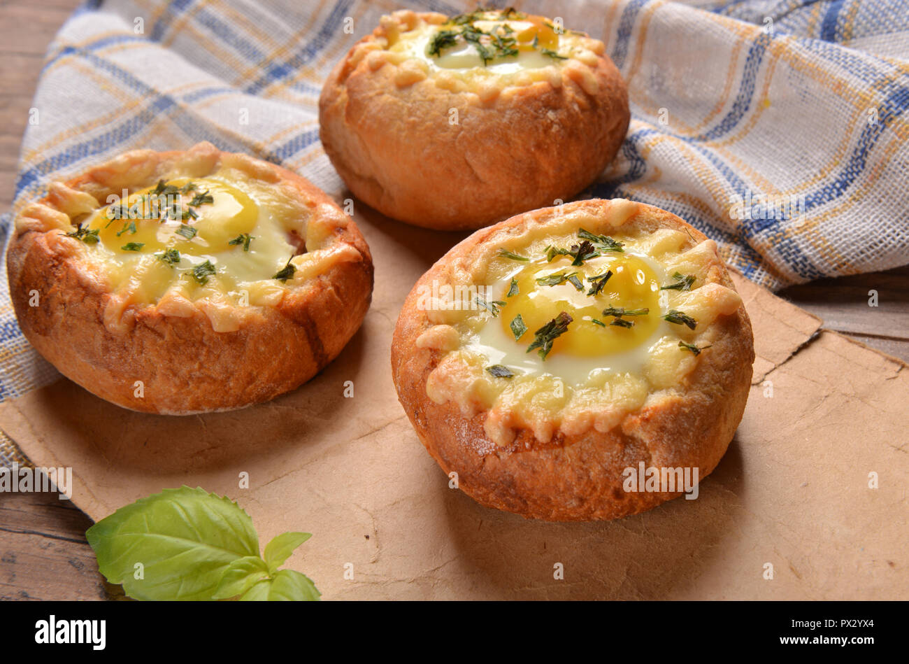 Roasted buns stuffed with eggs and bacon Stock Photo - Alamy