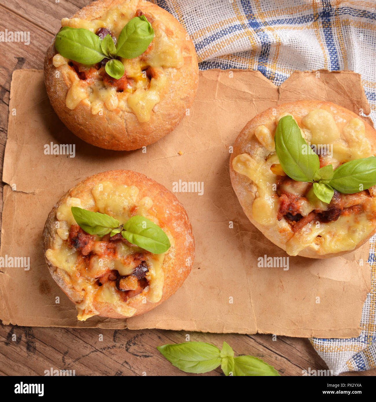 Roasted buns stuffed with meat, red beans and corn Stock Photo - Alamy