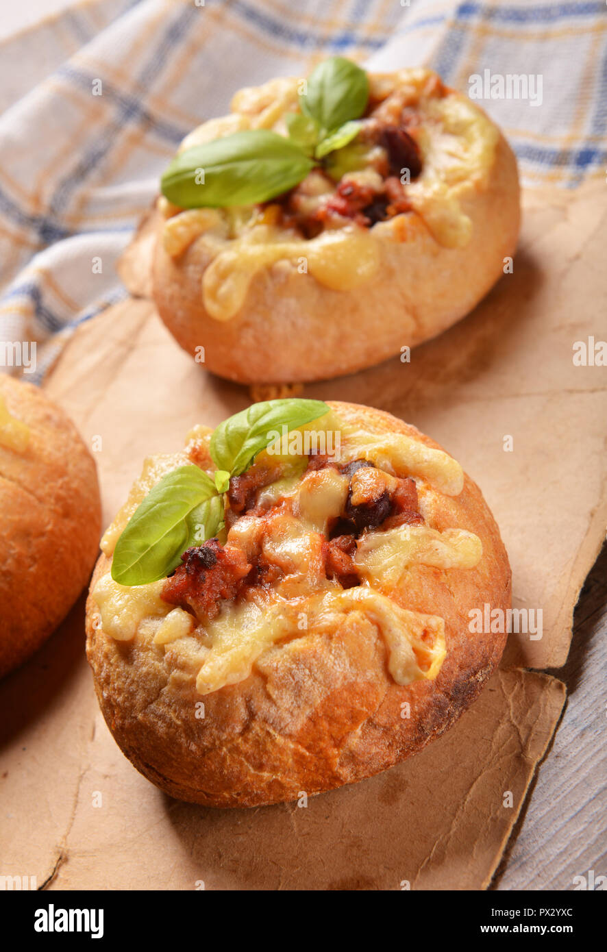 Roasted buns stuffed with meat, red beans and corn Stock Photo - Alamy