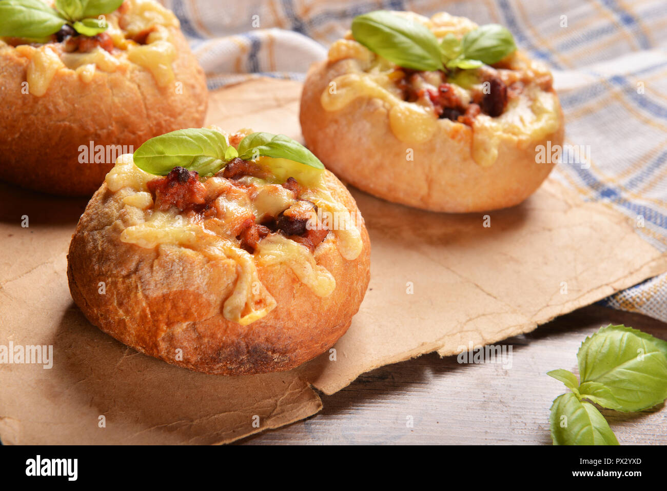 Roasted buns stuffed with meat, red beans and corn Stock Photo - Alamy